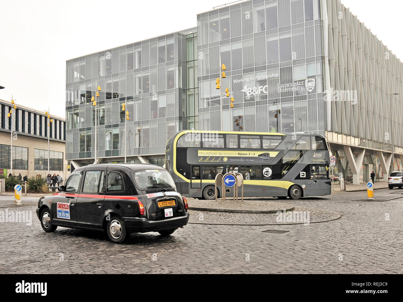 Bus and black cab negotiating roundabout in Bickerstaff Square ...