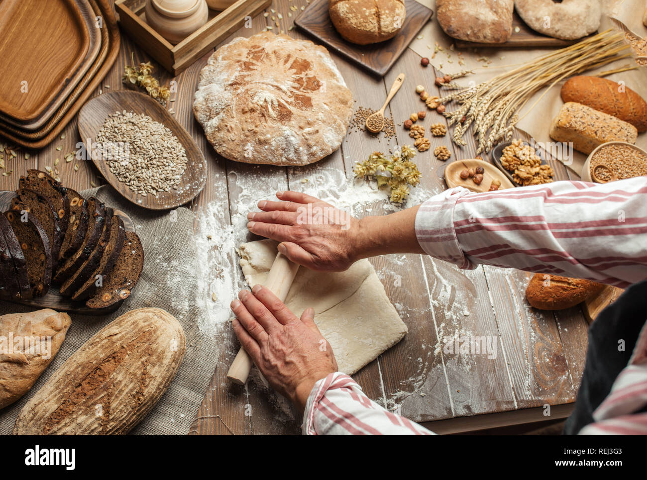 Man rolling pastry pin close hi-res stock photography and images - Alamy