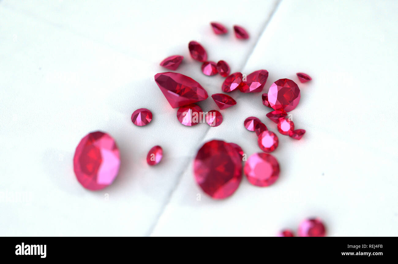 A macro view of a collection of various sized cut rubies on a light ...