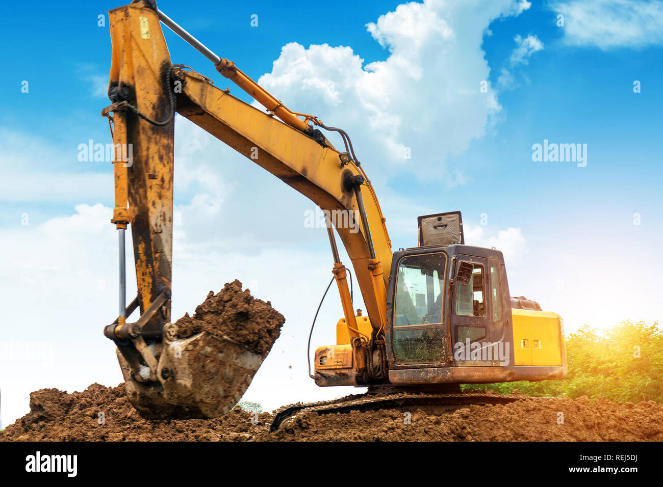 The excavator is working excavation site construction Stock Photo - Alamy