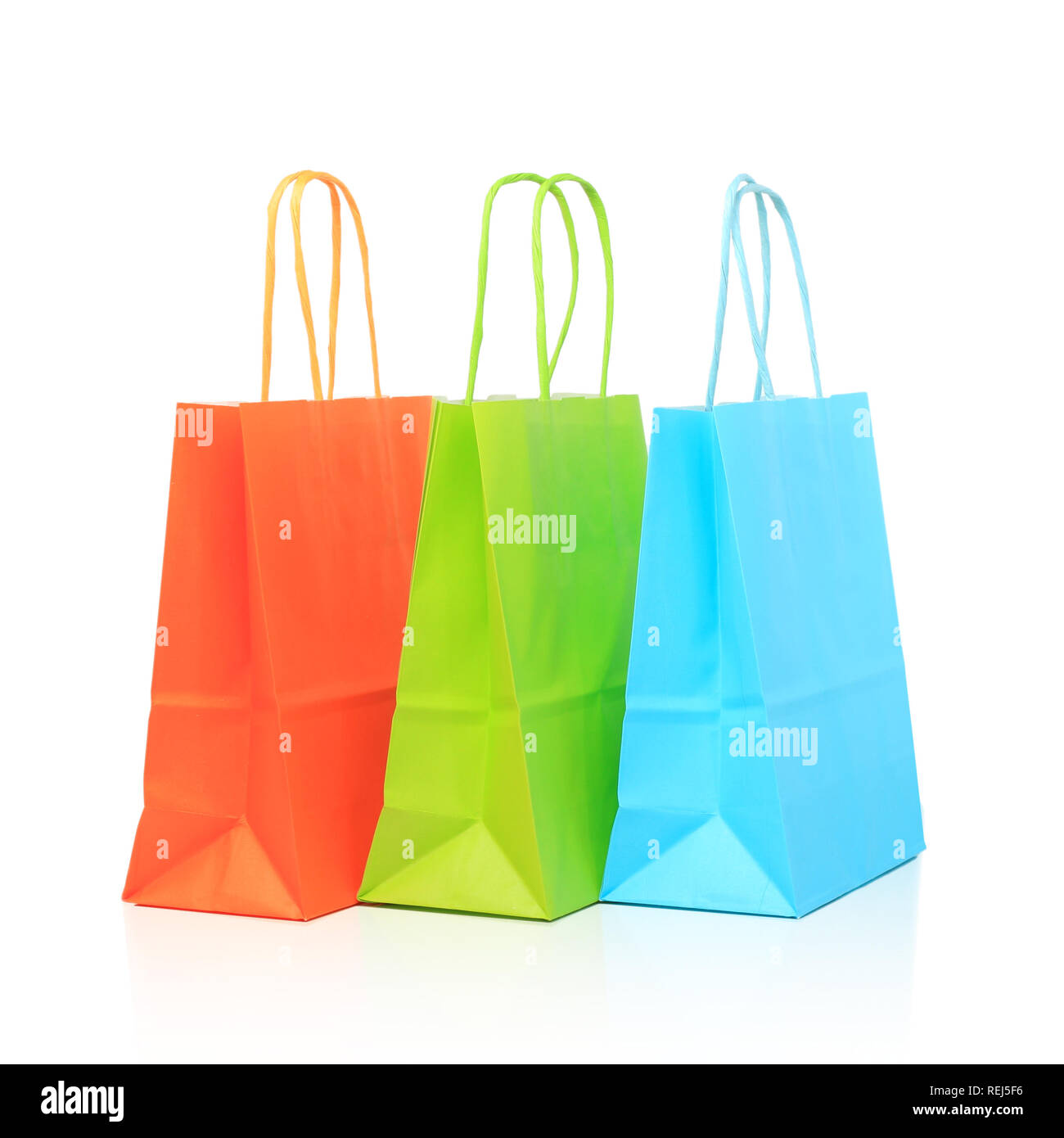 Three paper bags, isolated on white Stock Photo - Alamy