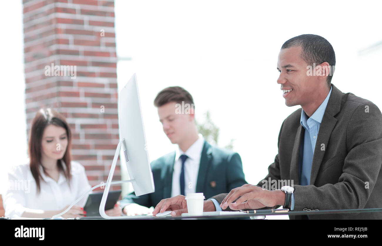 Boss sitting behind desk hi-res stock photography and images - Alamy