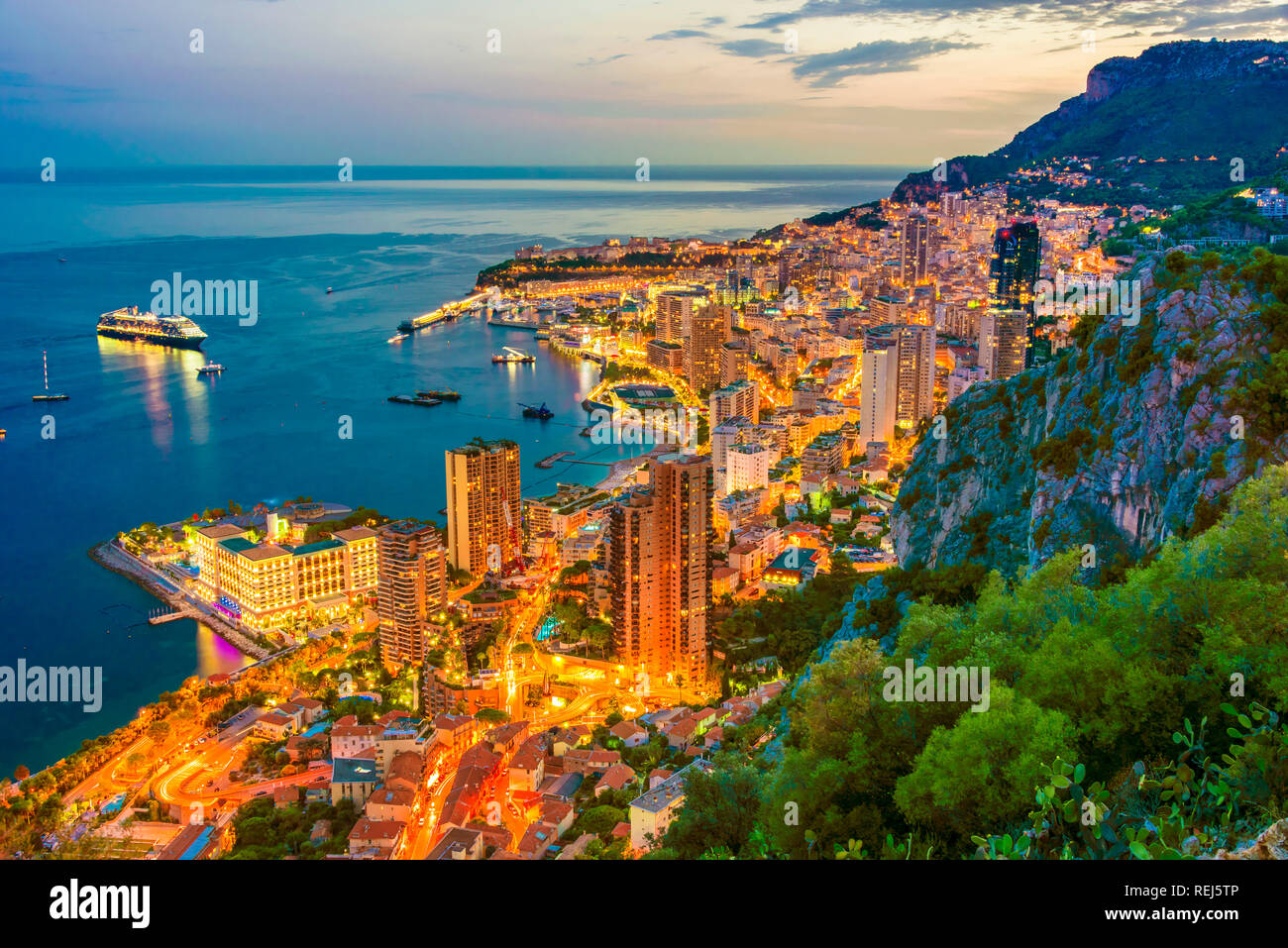 View of the city of Monaco on French Riviera after sunset Stock Photo ...