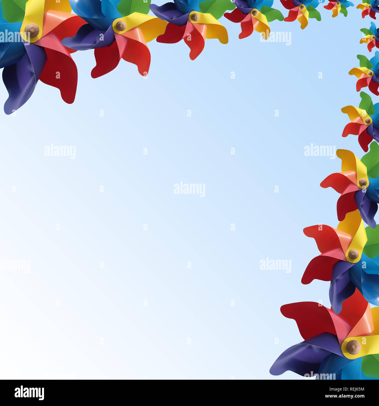 Pinwheel border over blue gradient background Stock Photo - Alamy