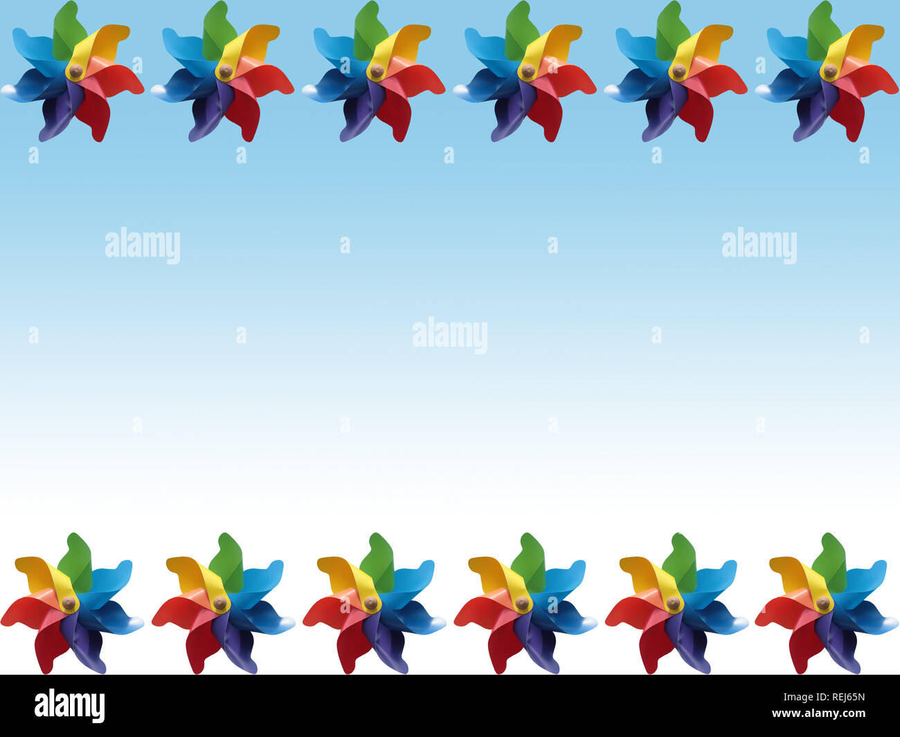 Pinwheel border over blue gradient background Stock Photo - Alamy