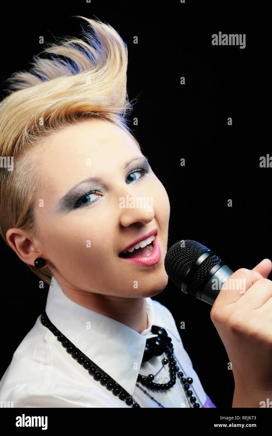 Female singer with special hair cut Stock Photo - Alamy