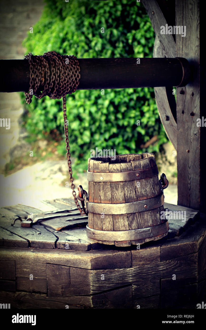 Well and bucket in lomo technique Stock Photo - Alamy