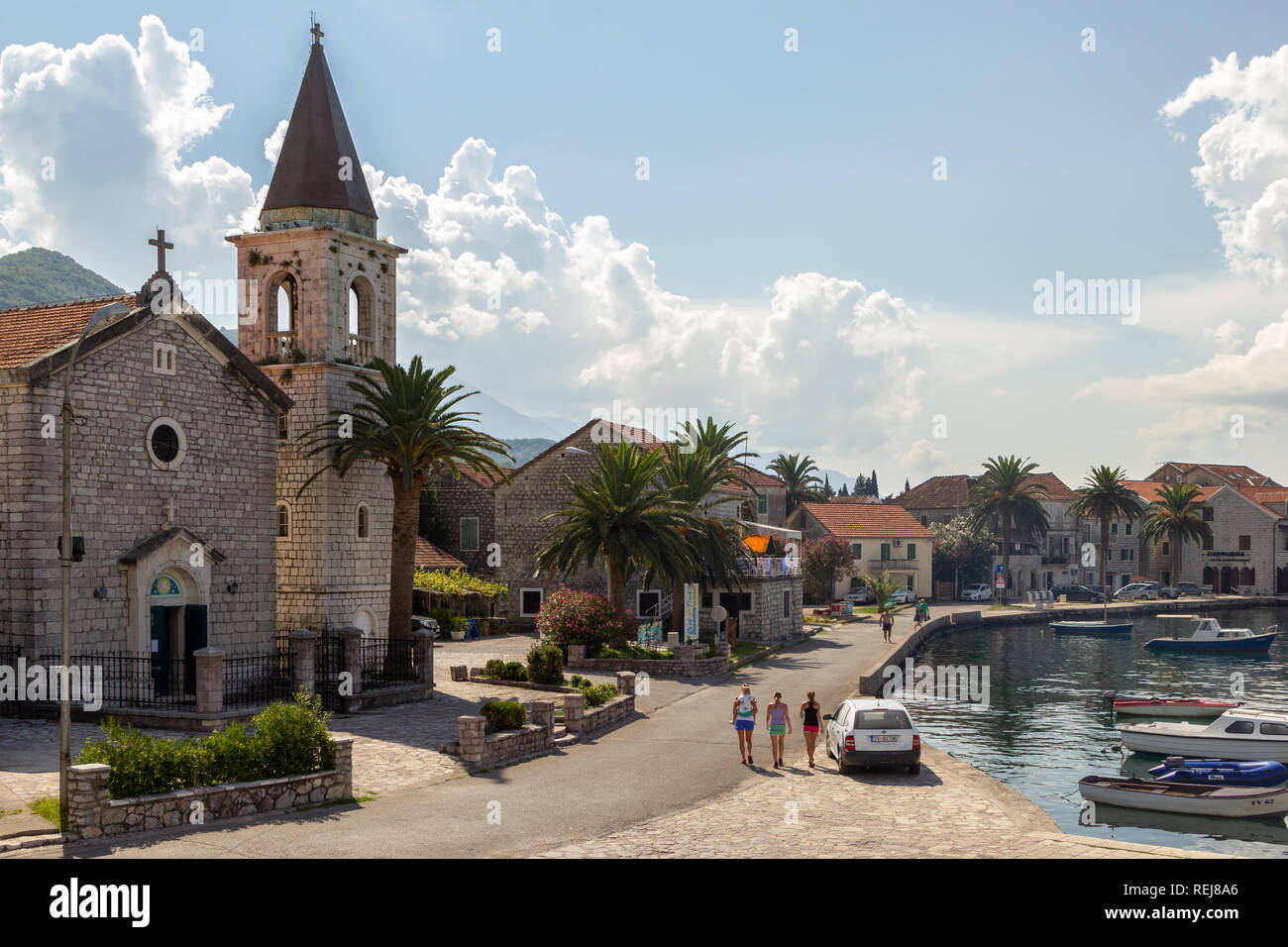 The Catholic St. Roko Church, ancient stone houses on the shores of the ...