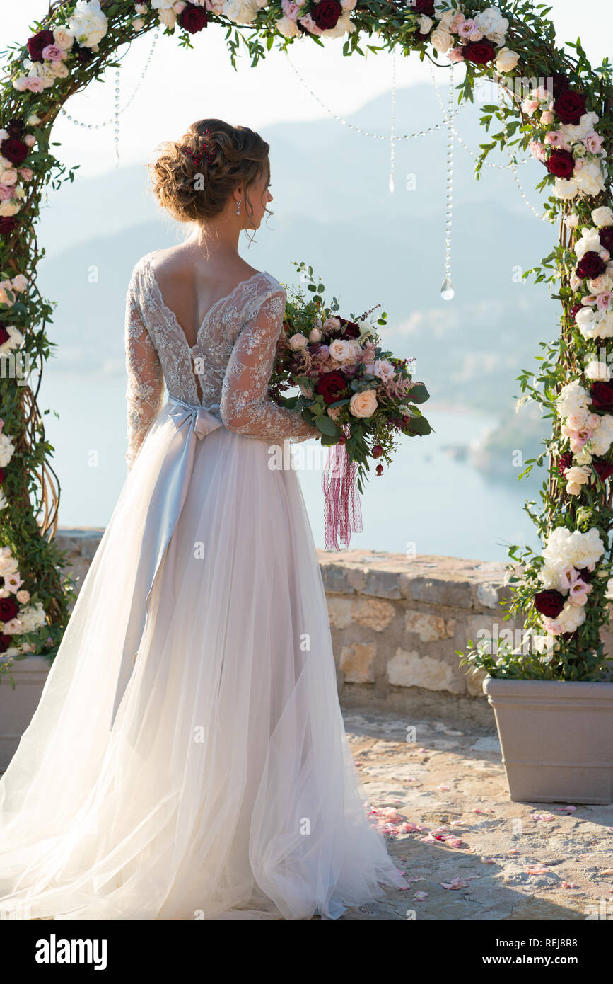 the bride is holding a magnificent wedding bouquet Stock Photo - Alamy