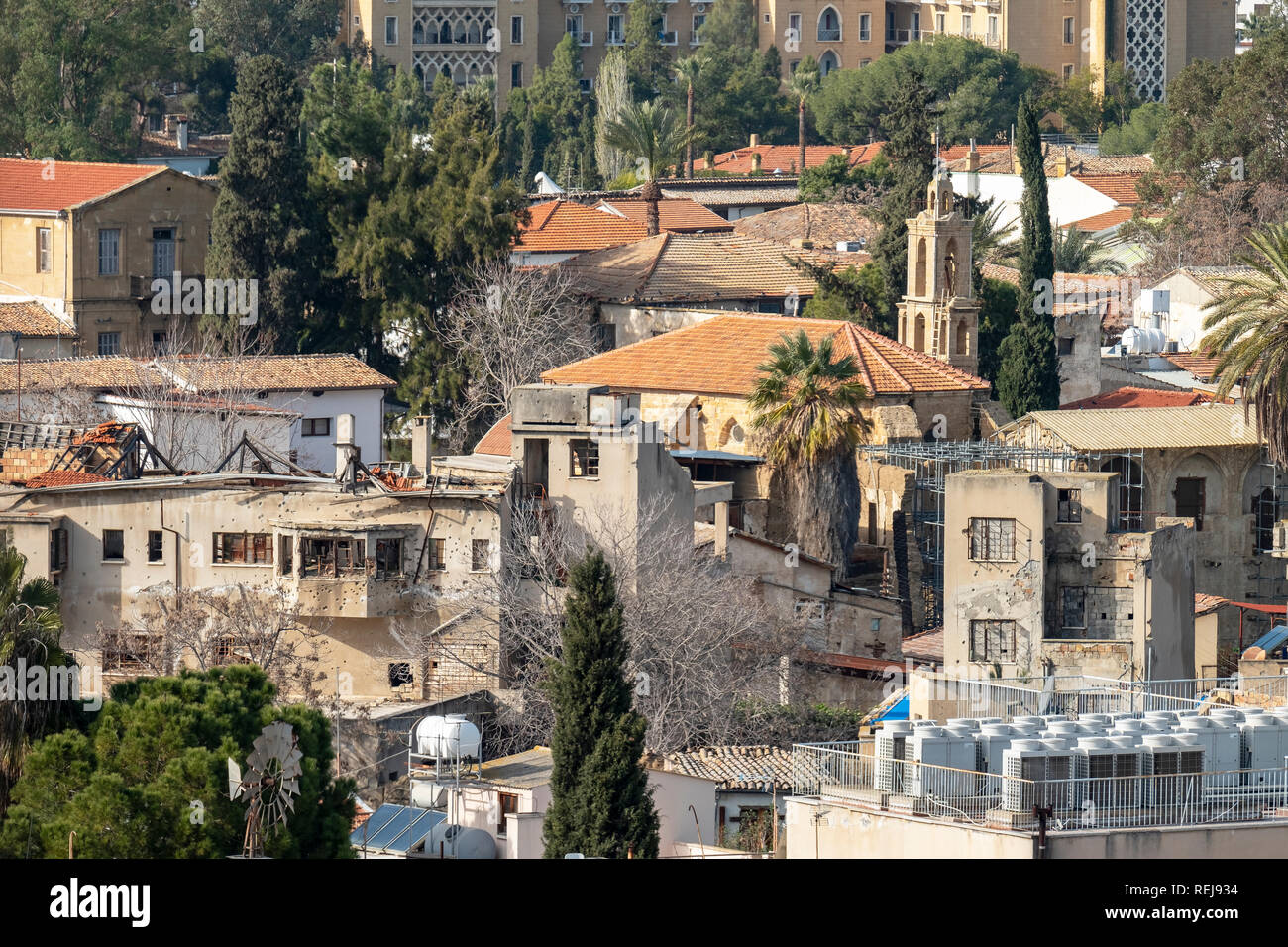 A view of damaged buildings on the buffer zone that separates the Greek ...