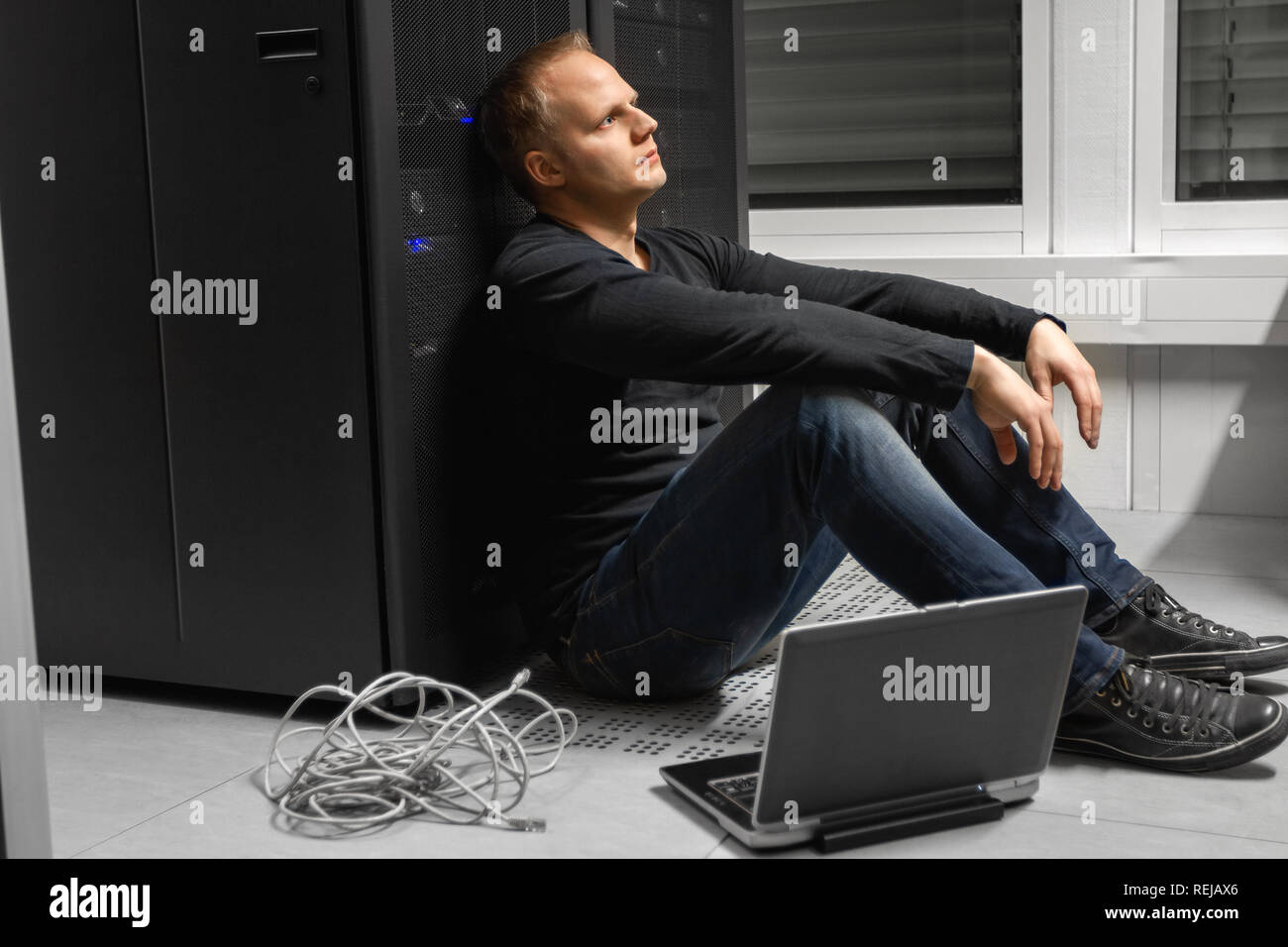 Exhausted Mid Adult Male IT Engineer Against SAN At Datacenter Stock ...