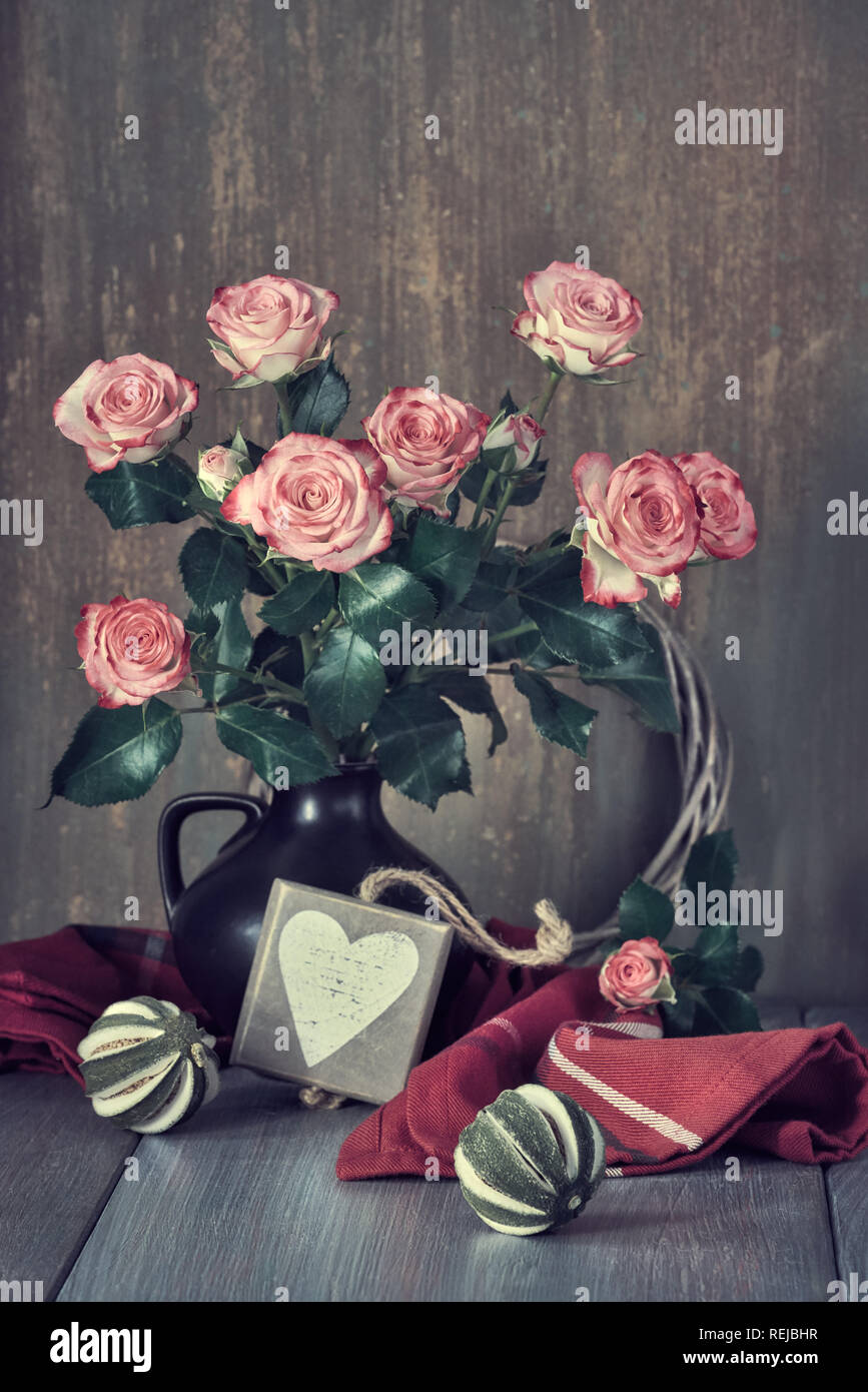 Valentine's day still lifewith wooden calendar, pink roses, heart and ...