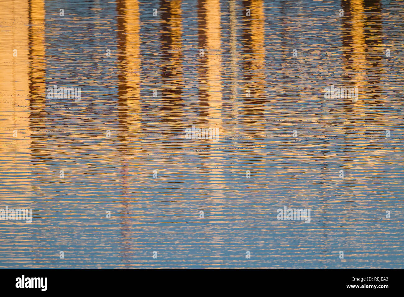 Abstract colorful water reflections of orange and blue Stock Photo - Alamy