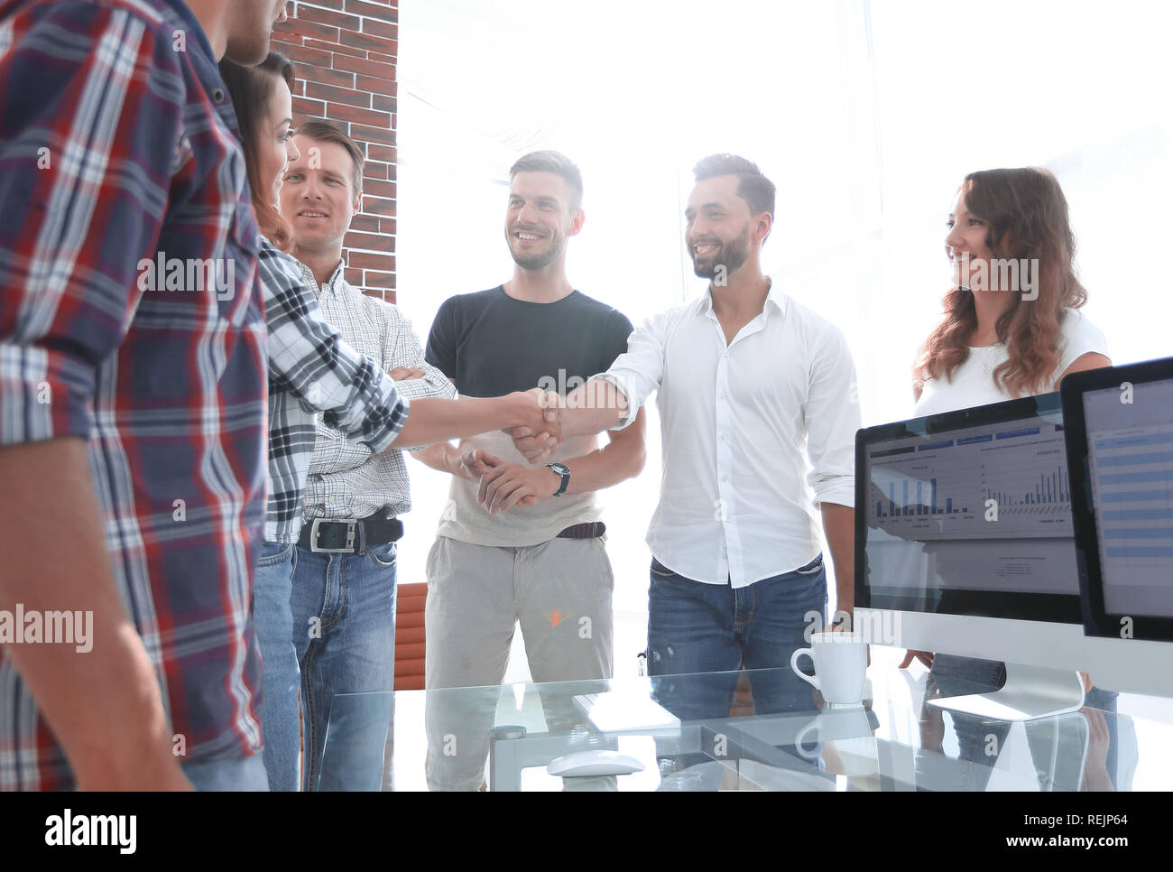 friendly handshake of partners in the office Stock Photo - Alamy