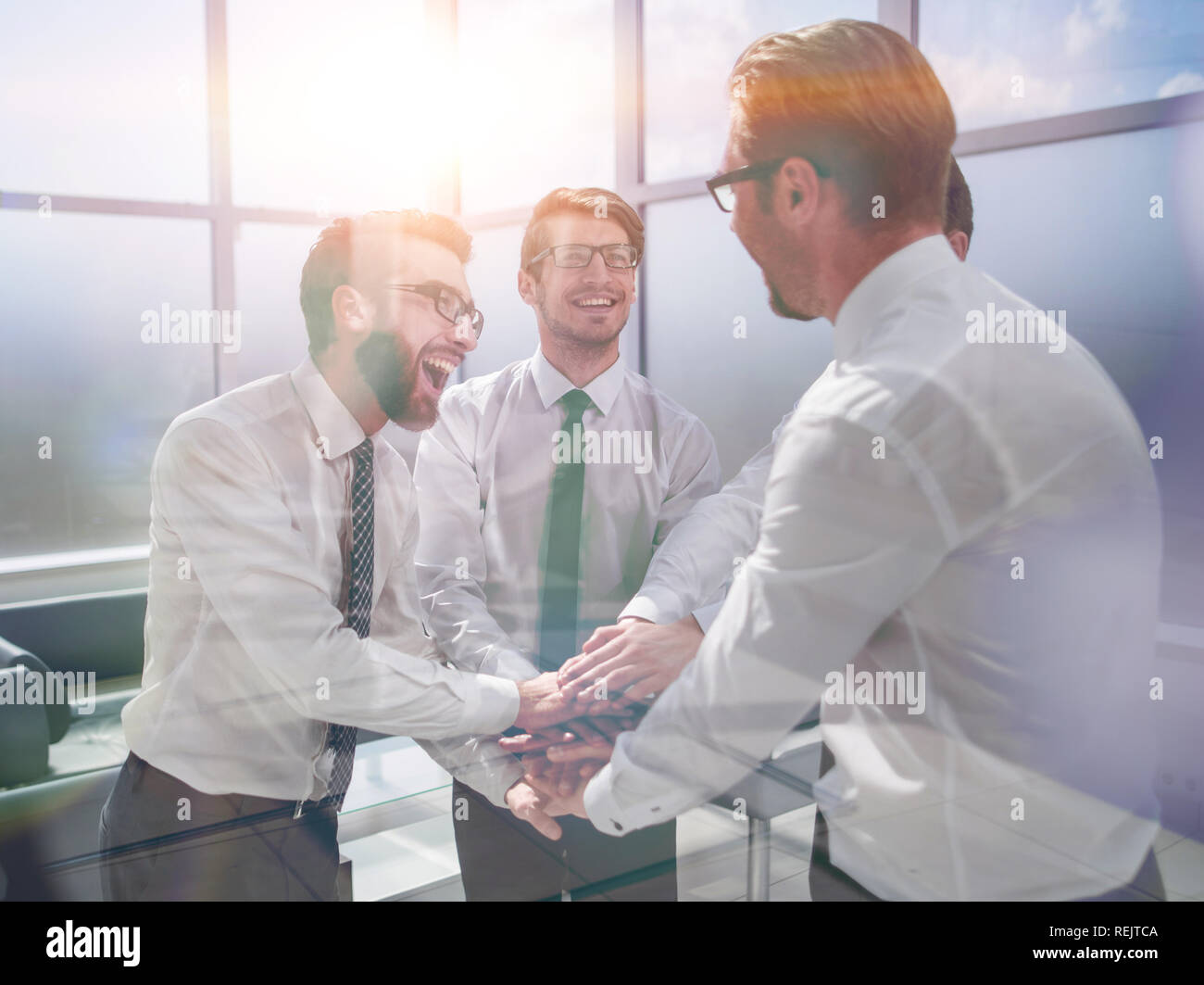 business team showing success with their hands together Stock Photo - Alamy