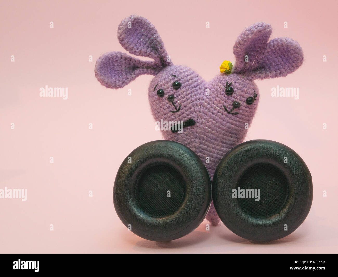 pair of plush toy rabbits with speakers of headphones. romantic radio ...