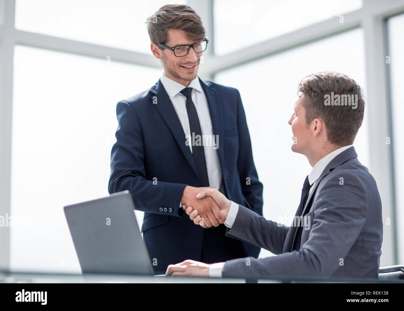 welcome handshake business colleagues in the office Stock Photo - Alamy