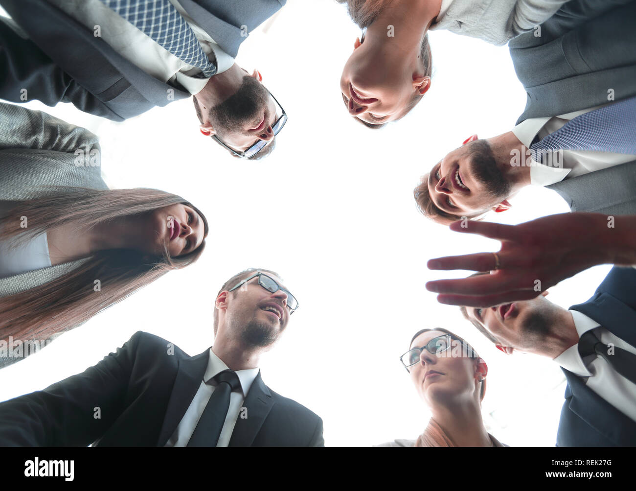 bottom view.a group of employees stands forming a circl Stock Photo - Alamy