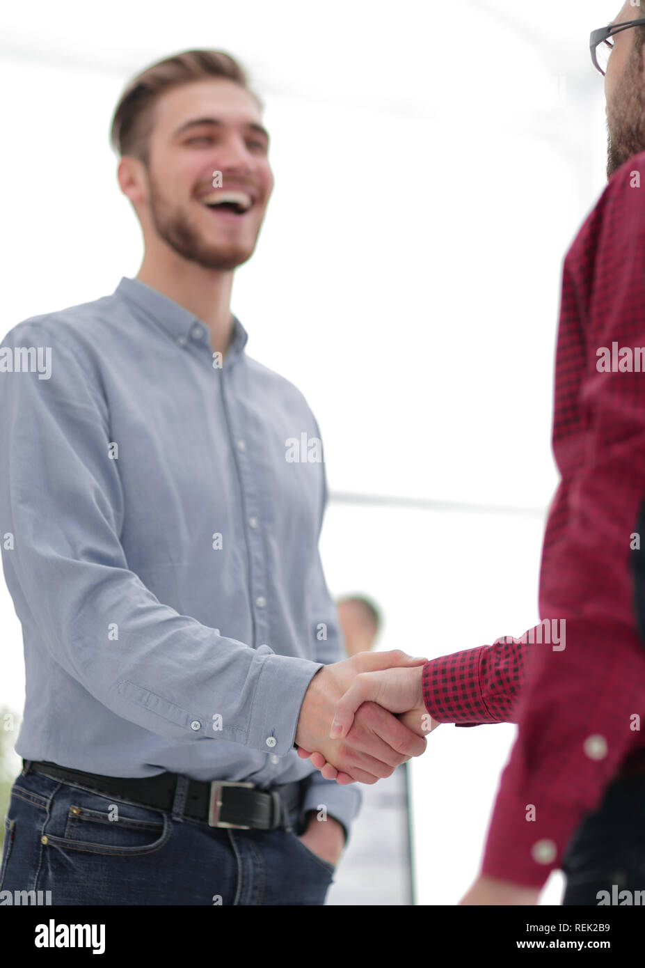 Portrait of two business partners shaking hands Stock Photo - Alamy