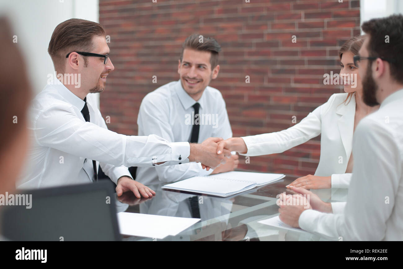 smiling Manager shaking hands with customer Stock Photo - Alamy