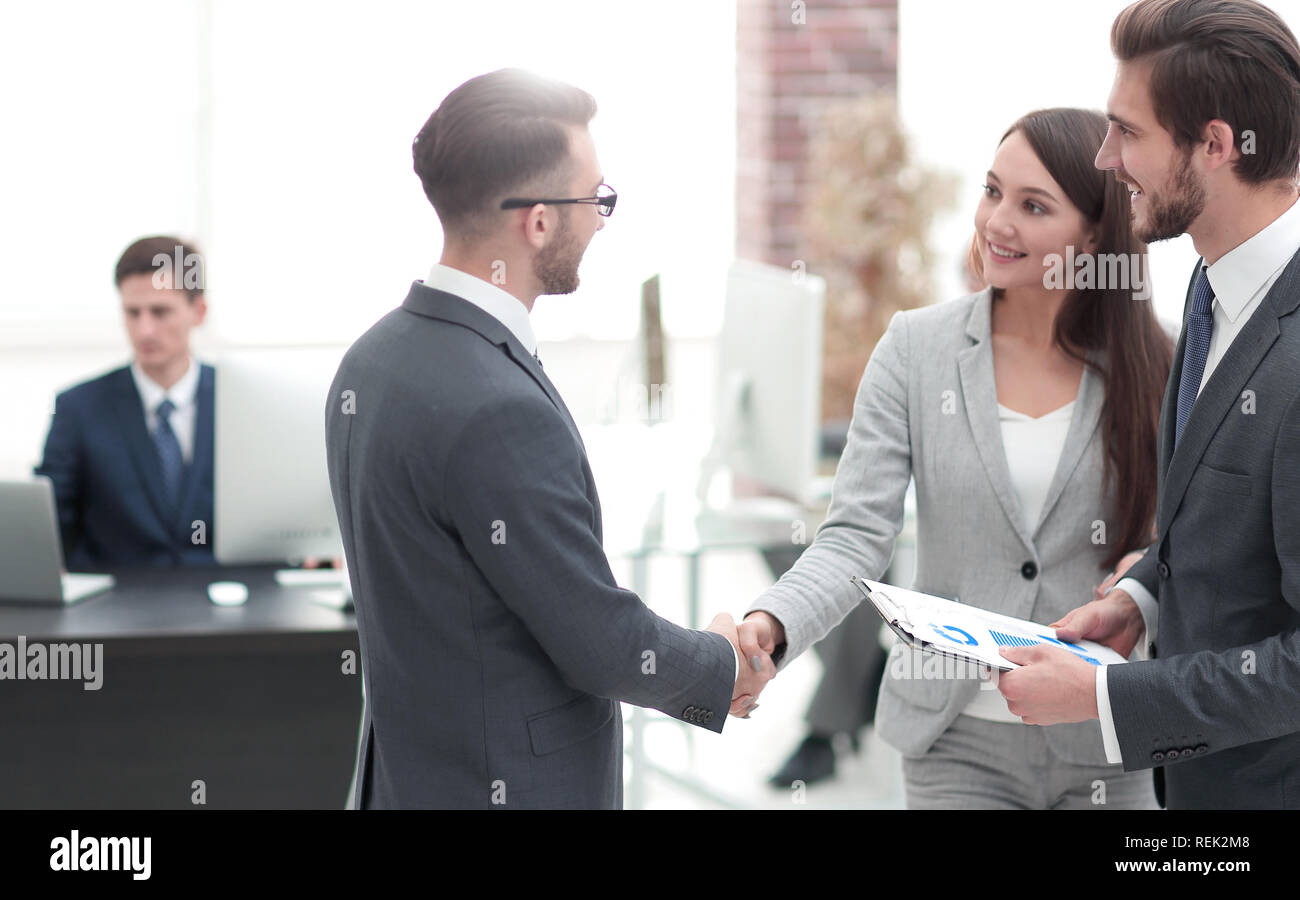 Young man introducing himself at meeting to his partners Stock Photo ...