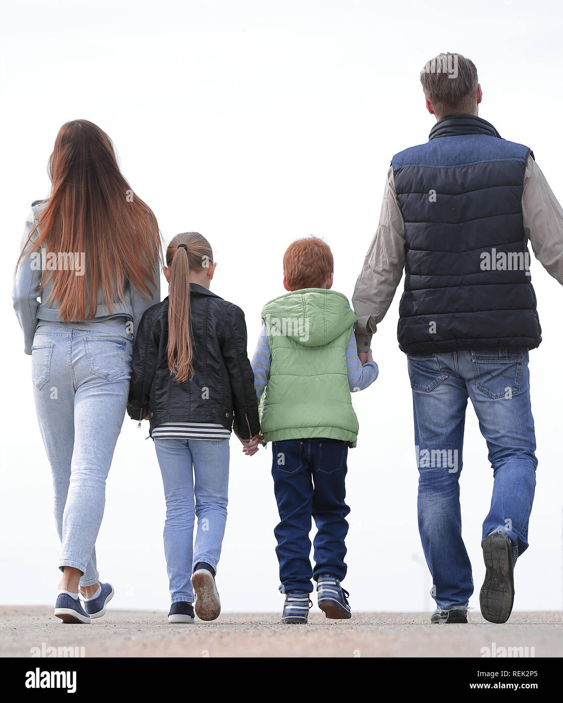 rear view.happy family walking together Stock Photo - Alamy