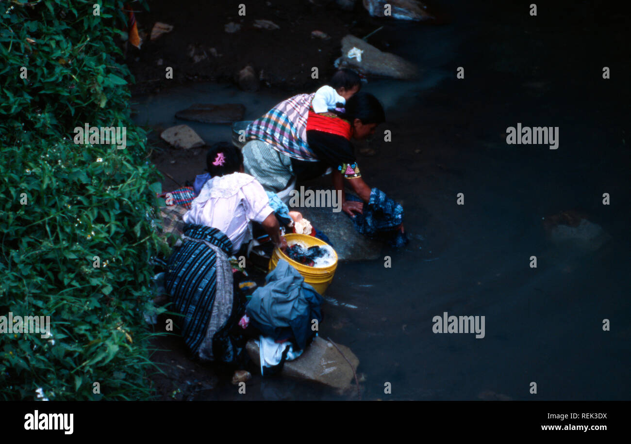 Indigenous Kiche Mayan women do laundry in the river in Momostenango ...