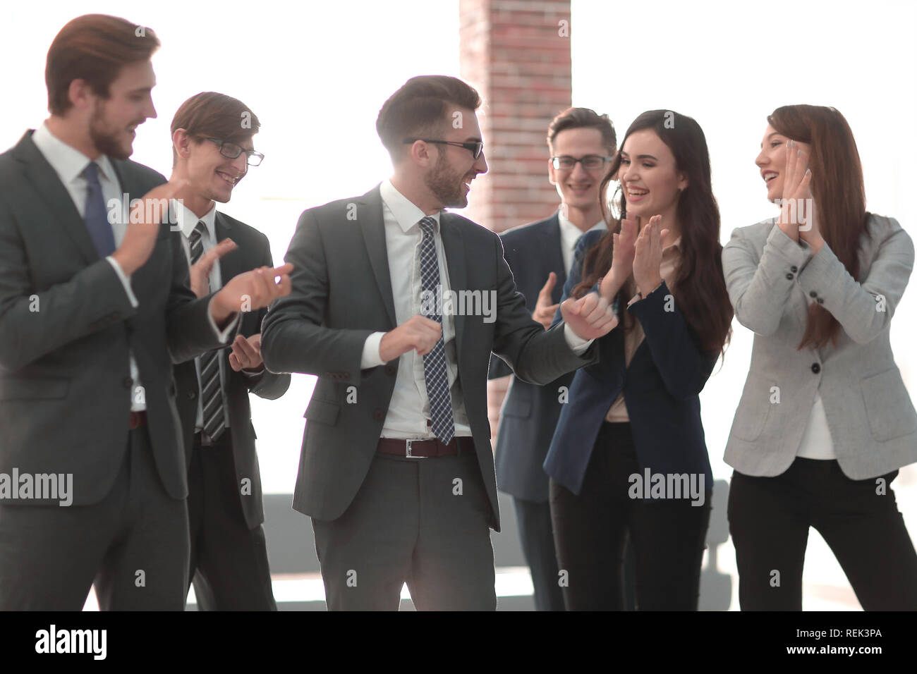 A team of business people congratulating each other Stock Photo - Alamy