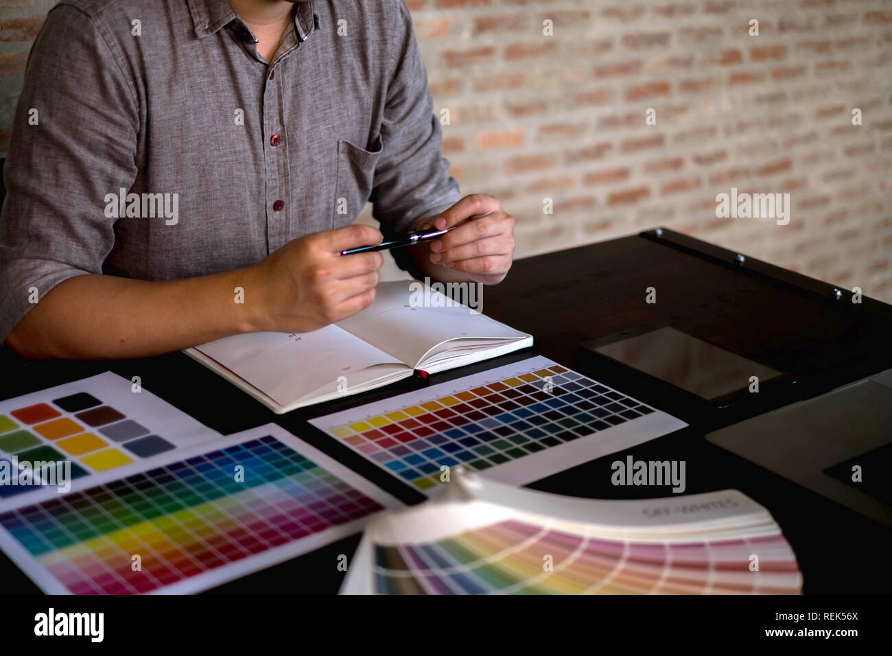 Graphic designers choose colors from the color bands samples for design ...