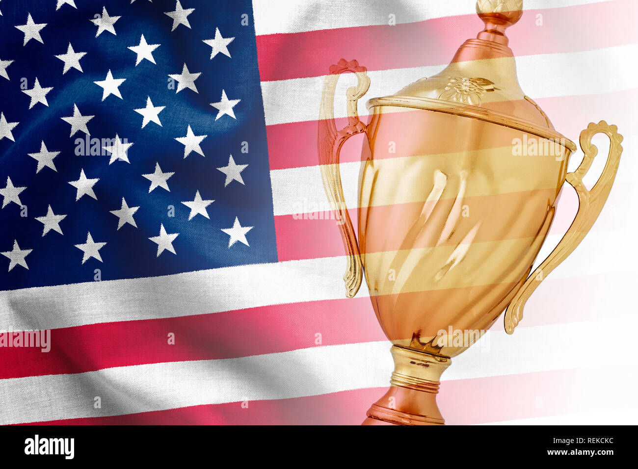 Gold trophy award superimposed on the national flag of USA in a concept ...