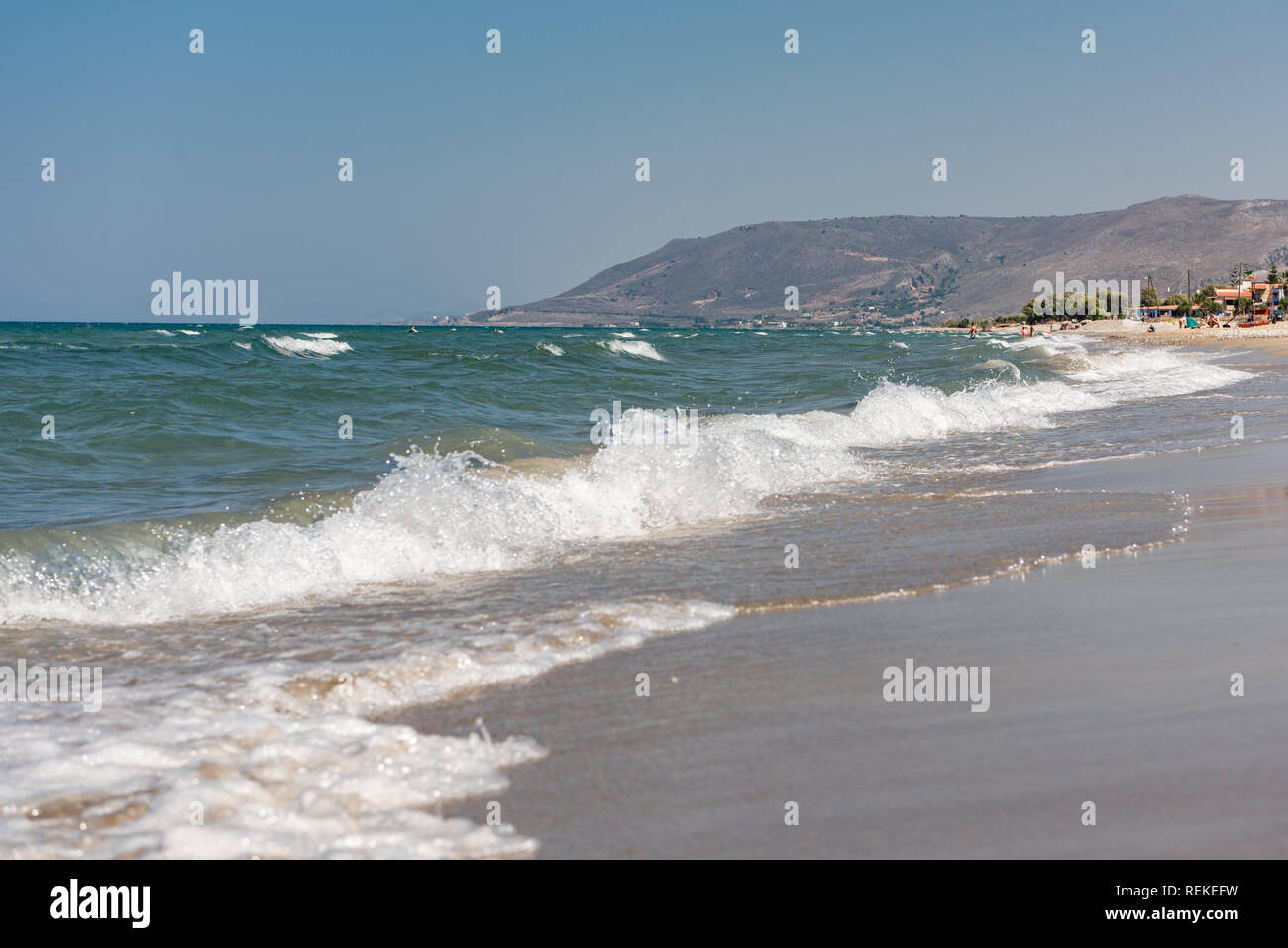 Waves on the beach of Crete Stock Photo - Alamy