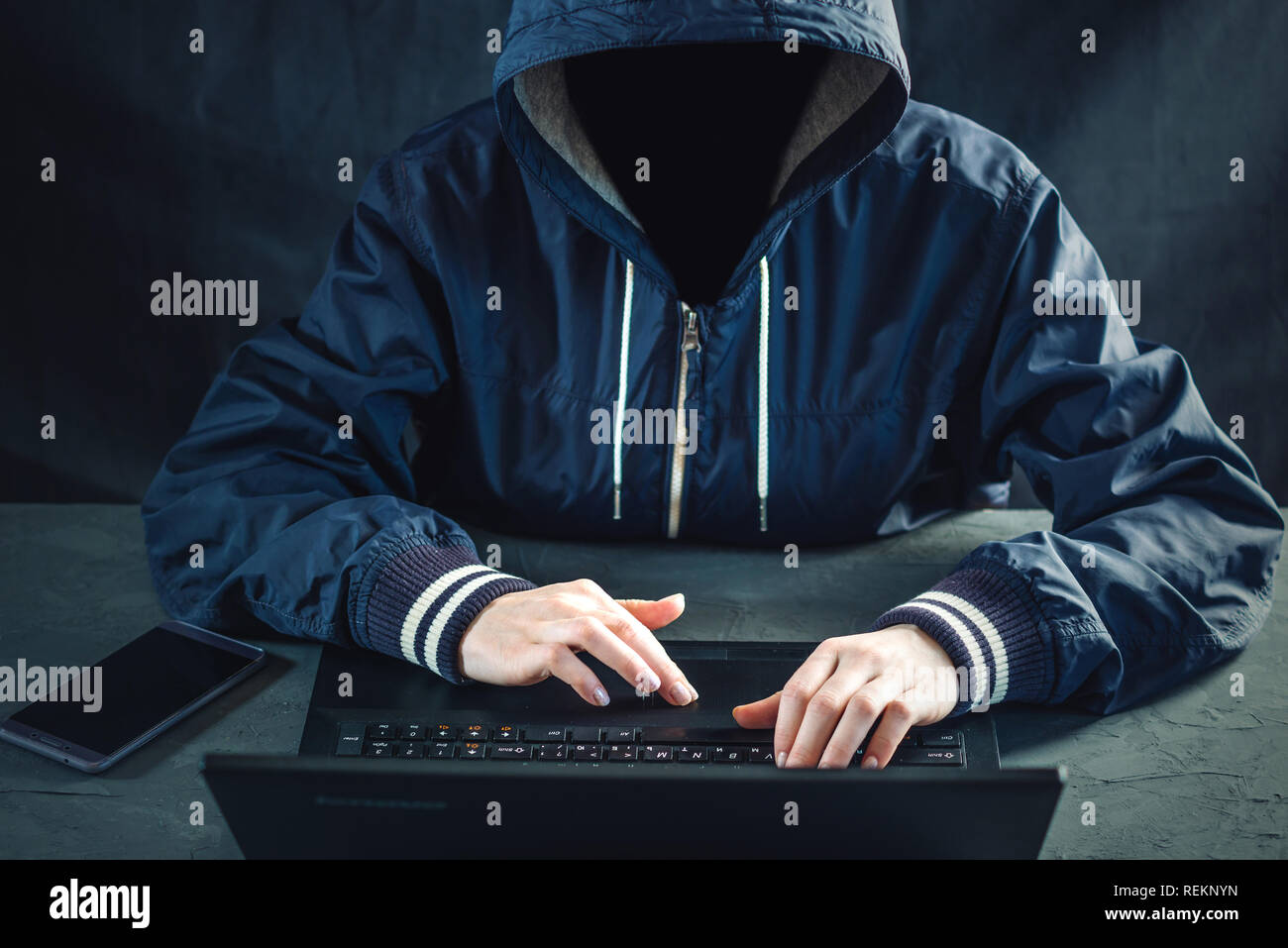 Anonymous Hacker Programmer Uses A Laptop To Hack The System Stealing