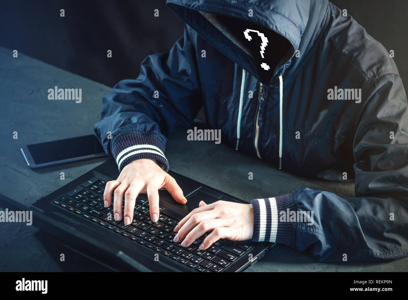 Anonymous hacker programmer uses a laptop to hack the system. Stealing personal data. Creation ...