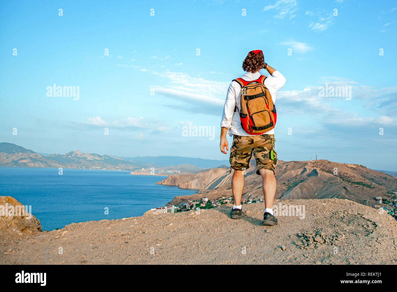 Man sitting top mountain overlooking hi-res stock photography and ...