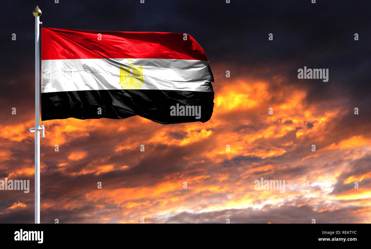flag of Egypt on flagpole fluttering in the wind against a colorful ...