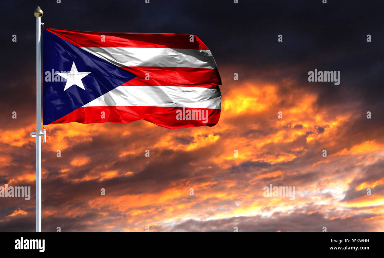 flag of Puerto Rico on flagpole fluttering in the wind against a ...