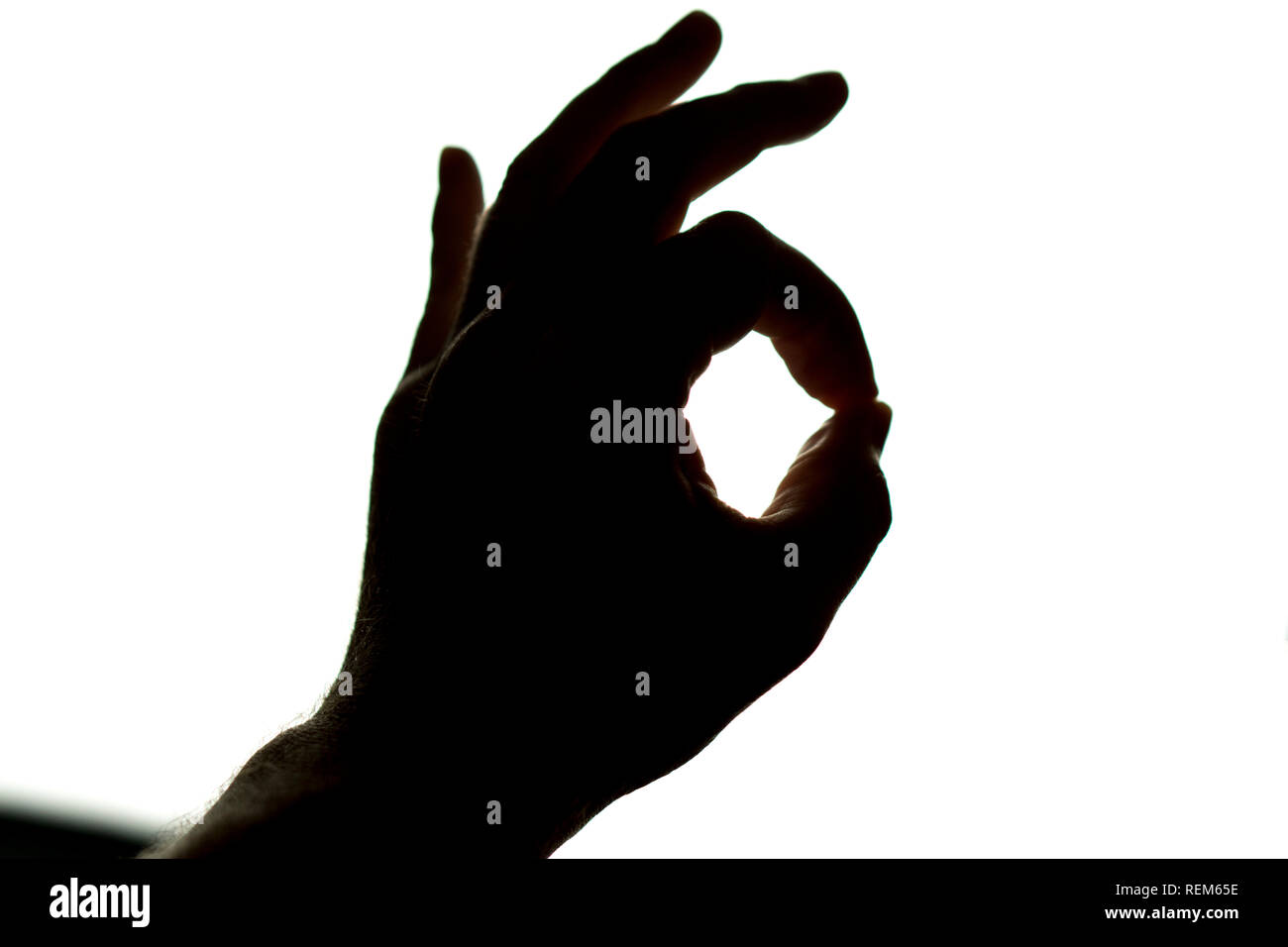 Silhouette of hand on white background making okay sign, signal for OK ...