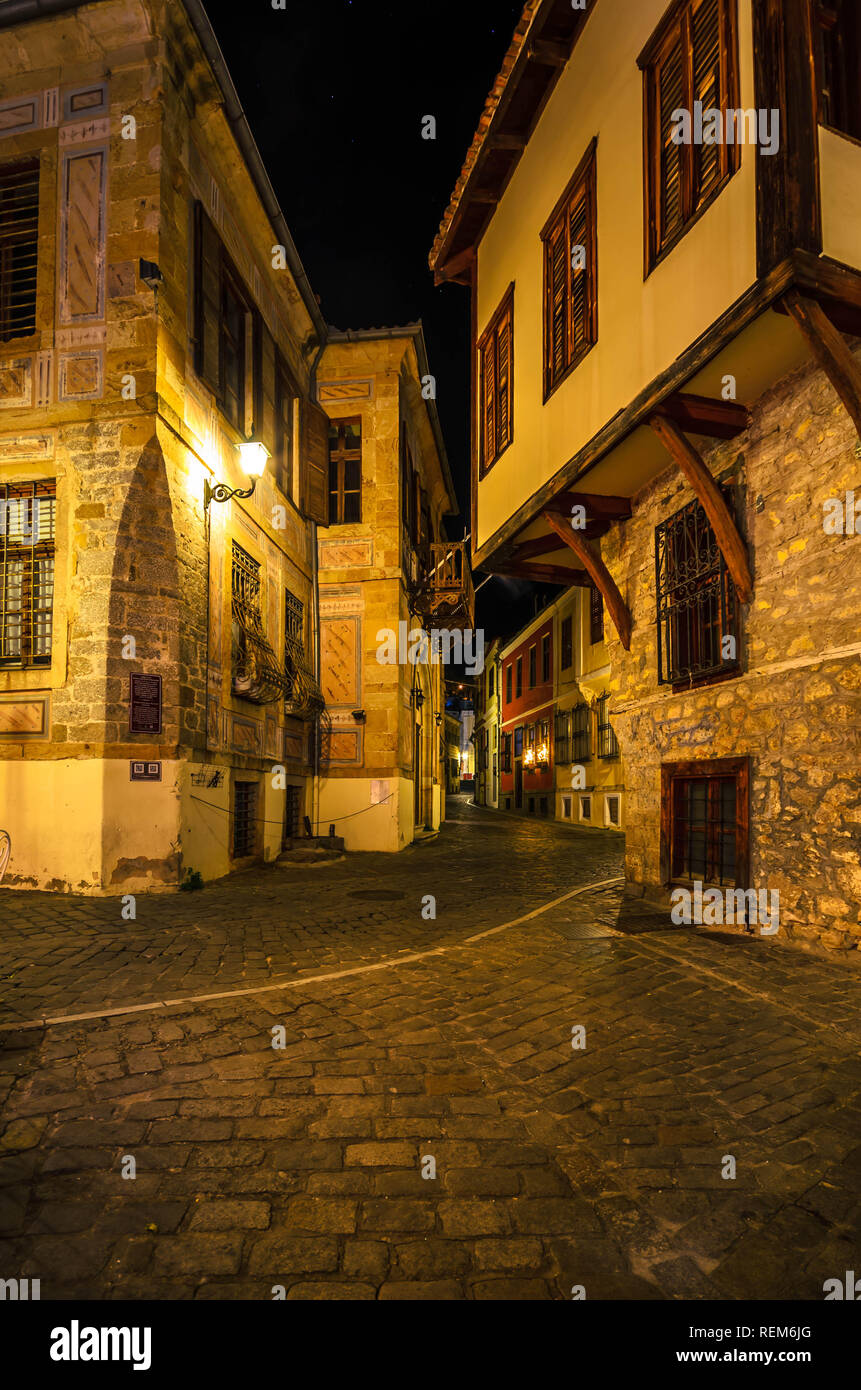 Picturesque narrow alley and neoclassical buildings at night ...