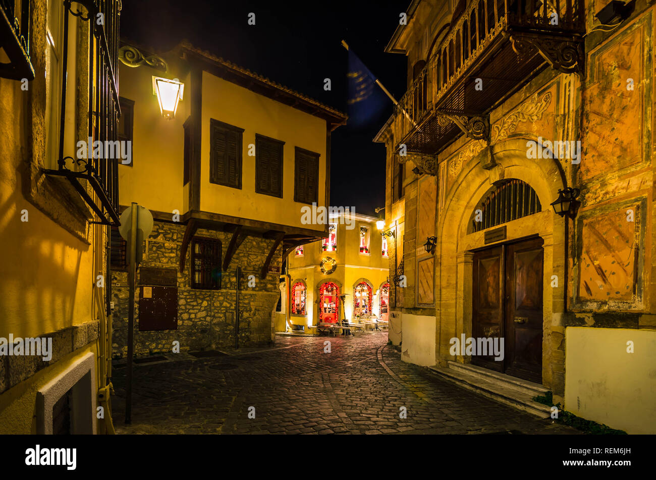 Picturesque narrow alley and neoclassical buildings at night ...
