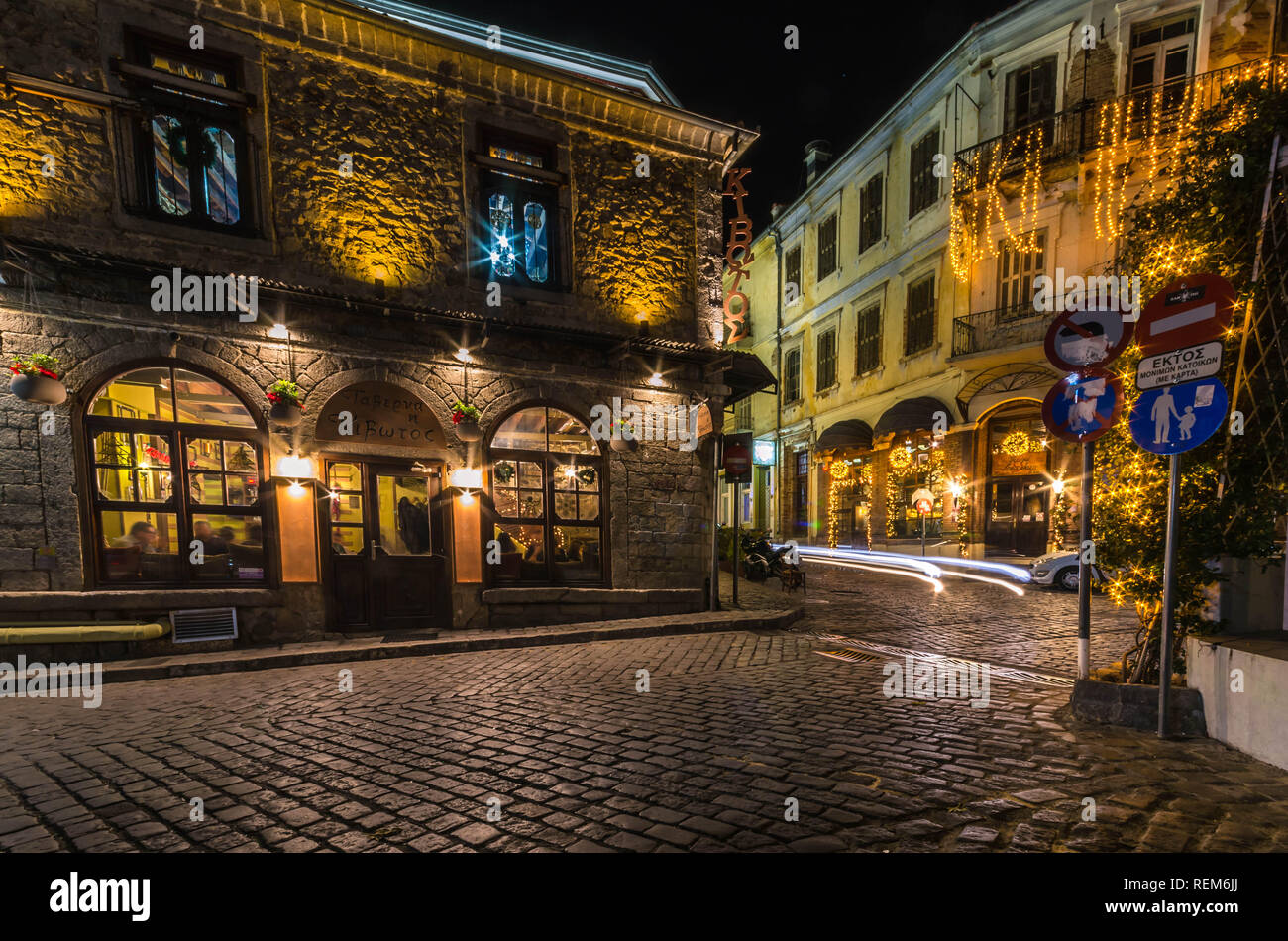 Picturesque narrow alley and neoclassical buildings at night ...