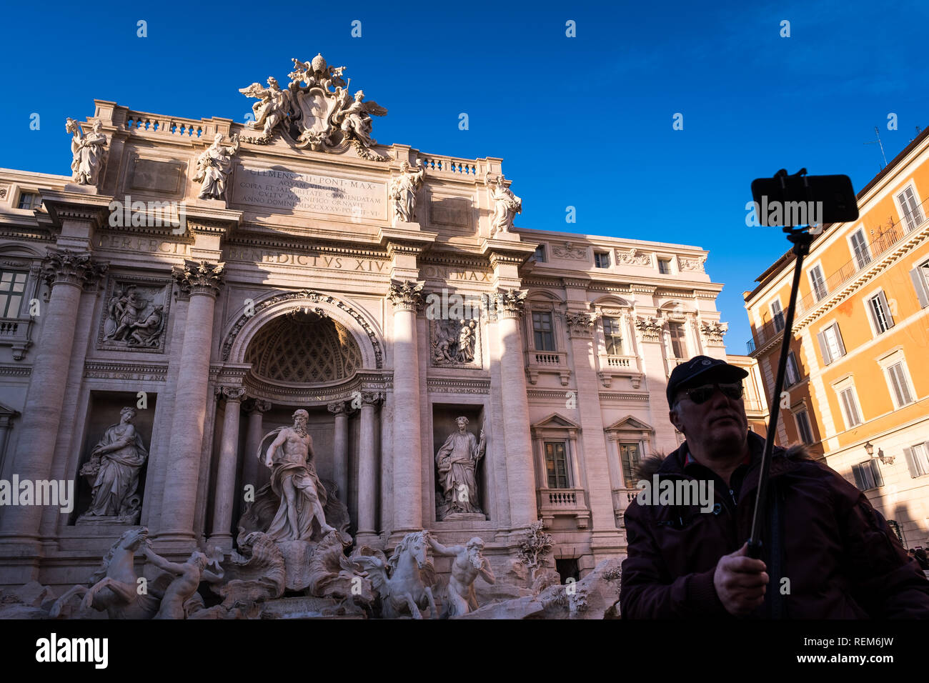 ROME, ITALY - JANUARY 06, 2019: the Trevi Fountain while a man takes a ...