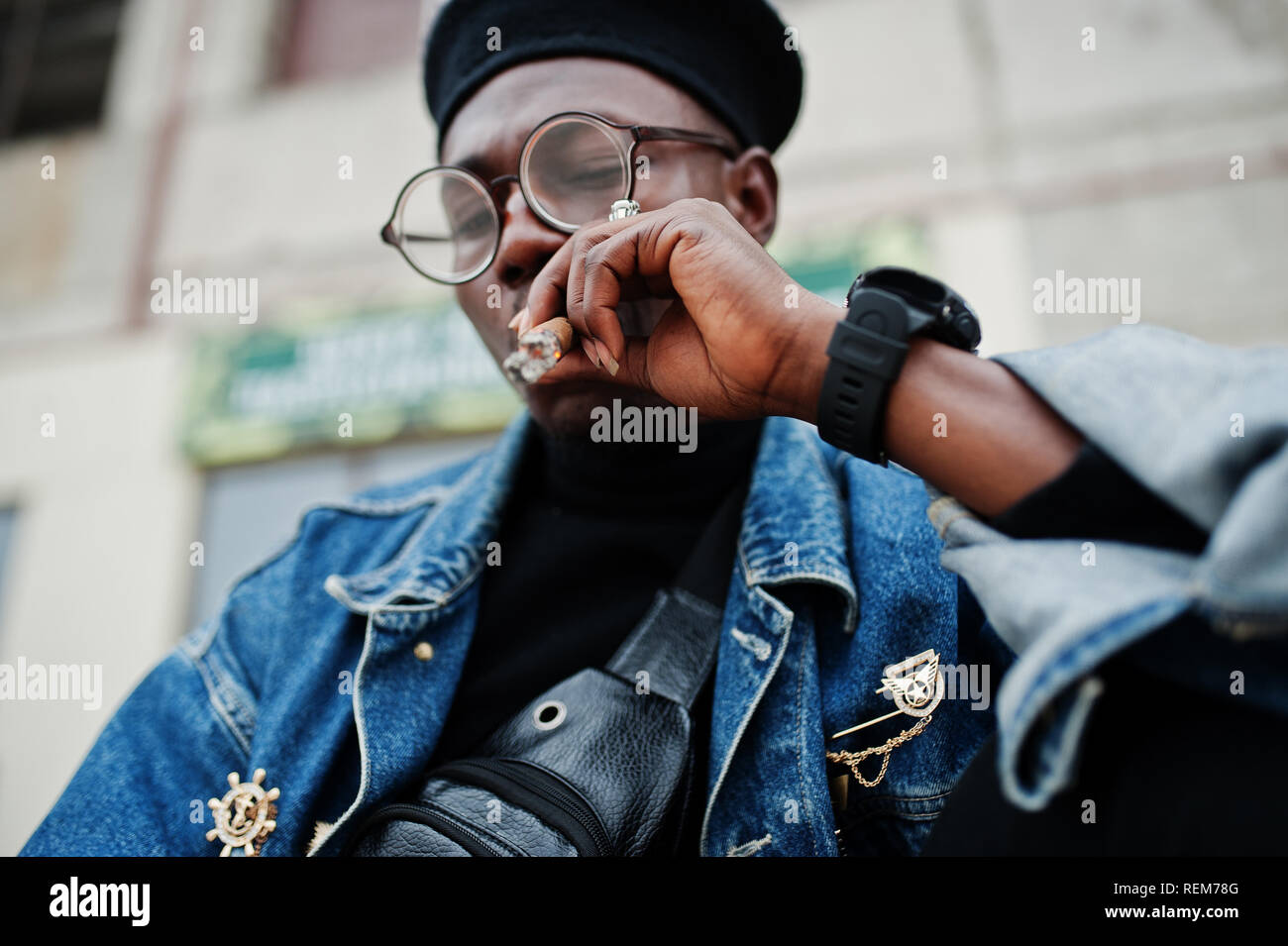 Close up portrait of african american man in jeans jacket, beret and ...