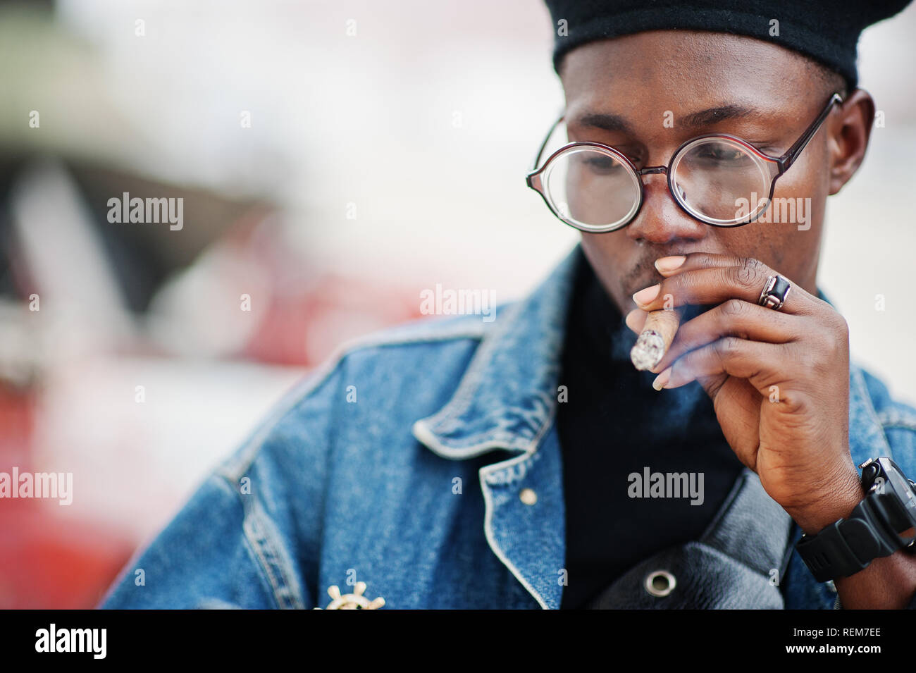 Close up portrait of african american man in jeans jacket, beret and ...