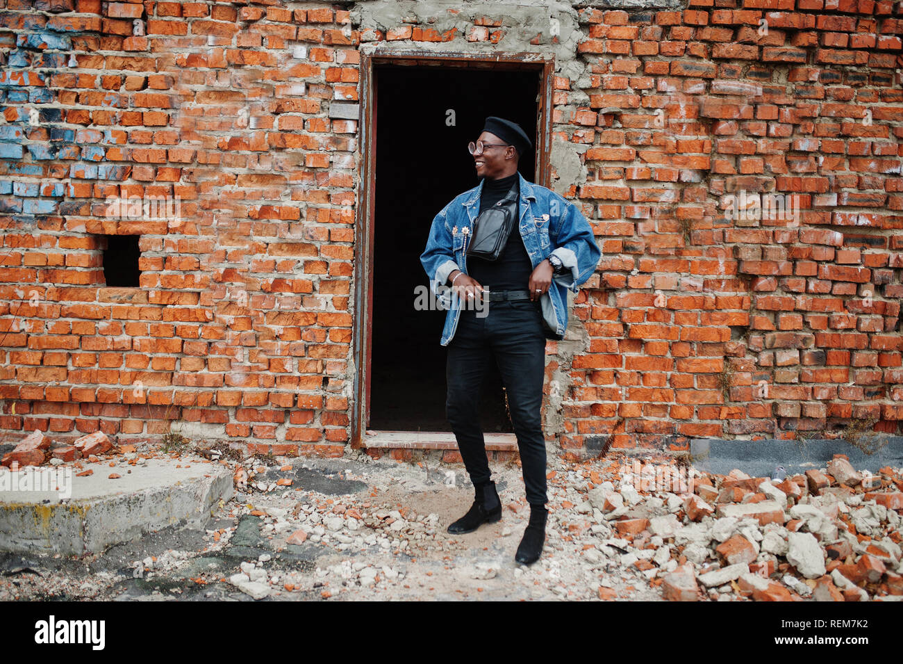 African american man in jeans jacket, beret and eyeglasses against ...