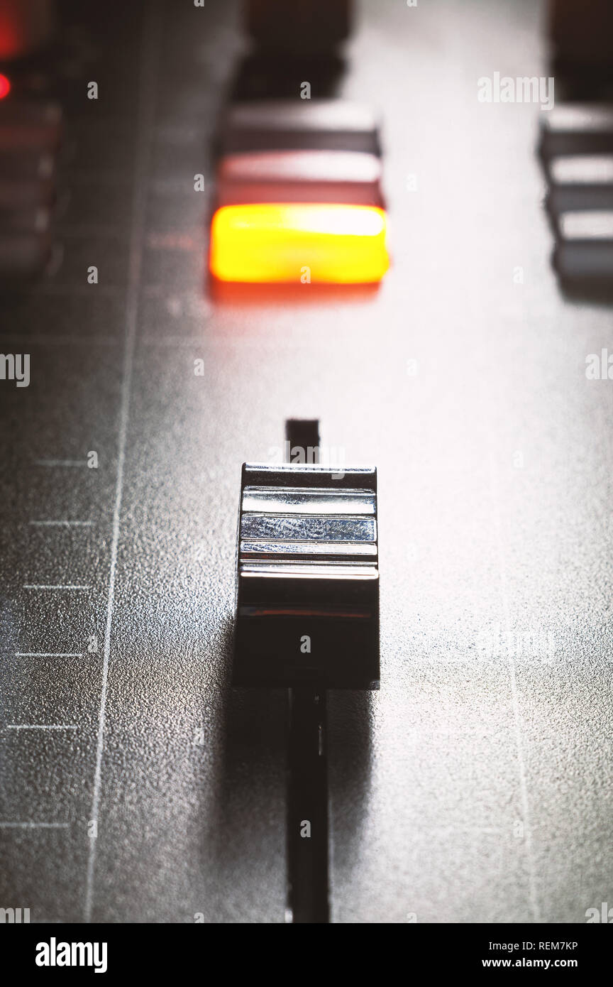 One fader of a modern mixing console, music studio equipment details ...