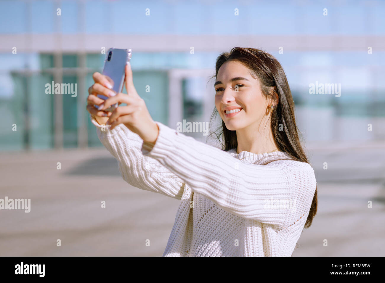 close up portrait girl taking a selfie with urban background - image ...