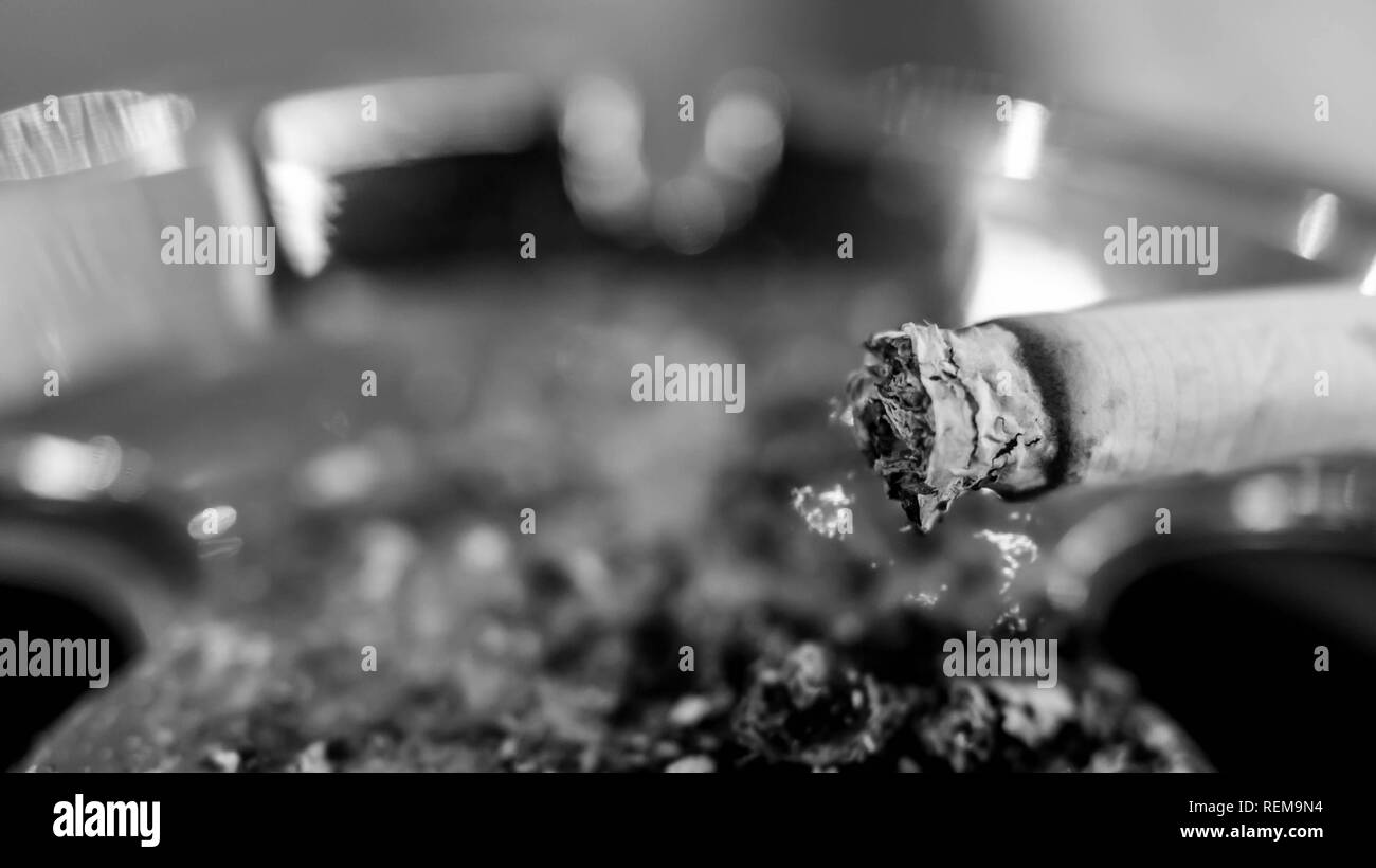 cigarette on metallic ashtray Stock Photo - Alamy