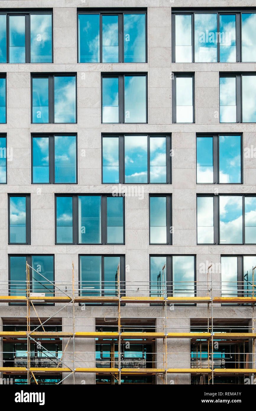 modern office building facade front partly, with scaffolding Stock ...