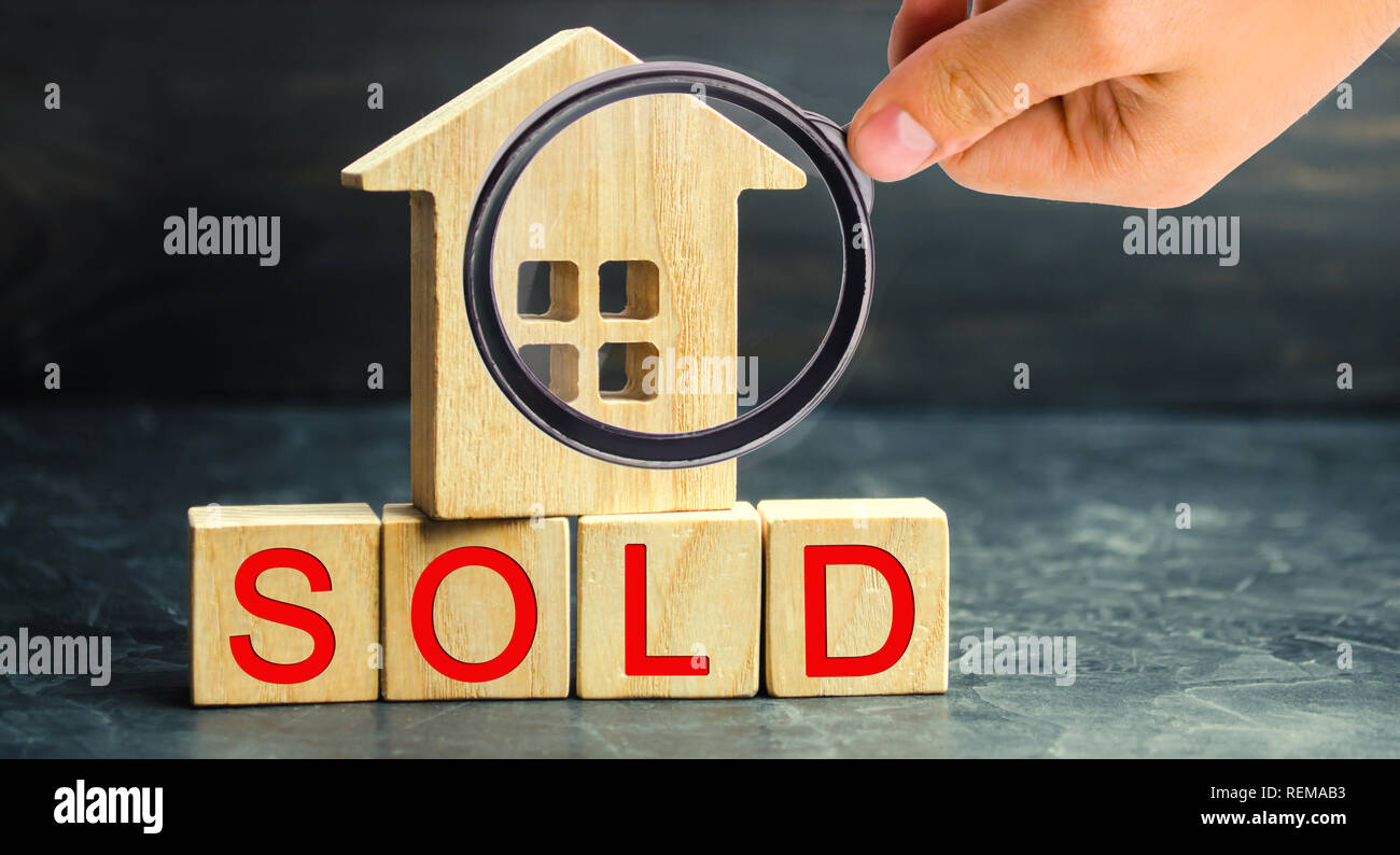 wooden house with the inscription "sold". sale of property, home, real ...