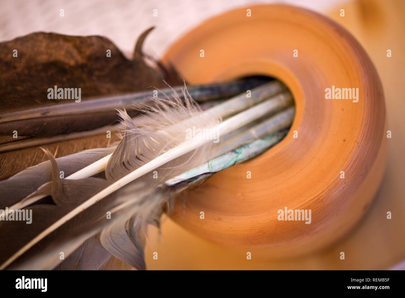 Feather pen in clay inkwell. Medieval, vintage, retro background ...
